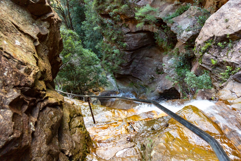 Slippery Dip Falls - a cascading waterfall next to a walking track ...