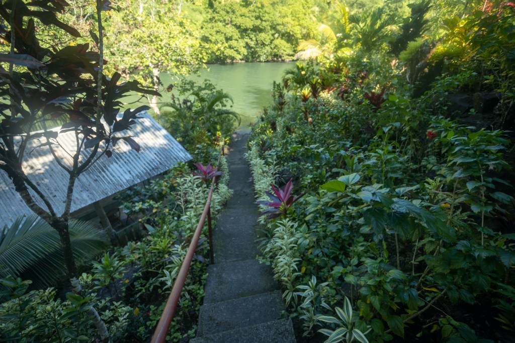 Falefa Falls - a waterfall that drops into a deep bay | Hiking the World