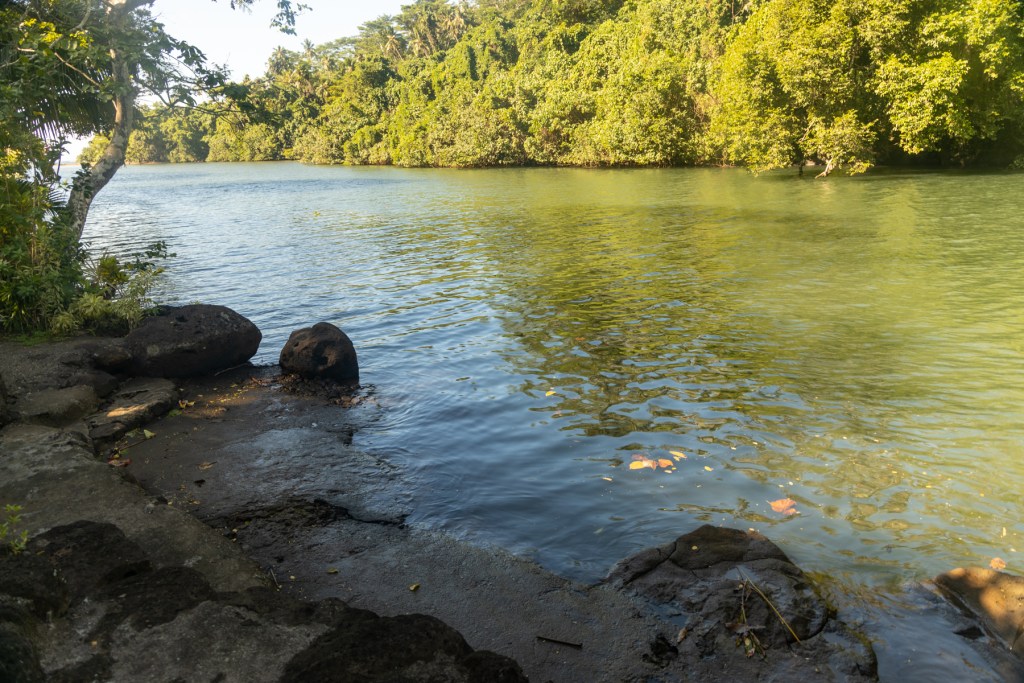 Falefa Falls - a waterfall that drops into a deep bay | Hiking the World